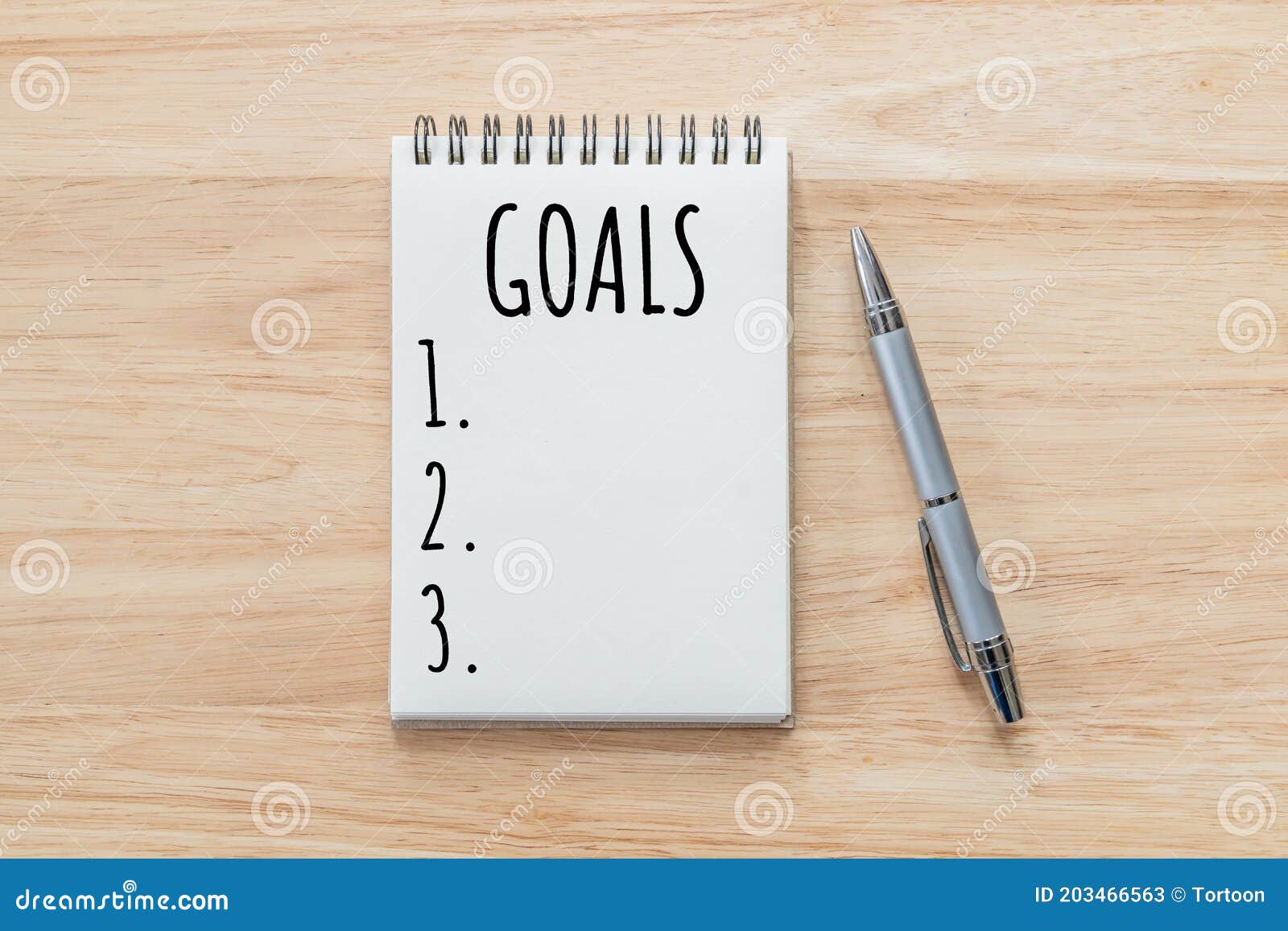 Top View of Notepad with Goals List on Wooden Table, Goals Concept ...
