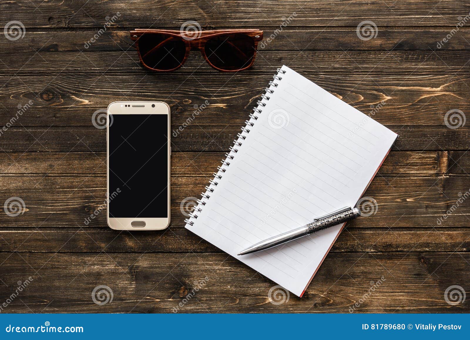 Top View of Notepad, Phone Pen and Sunglasses on Wooden Background ...