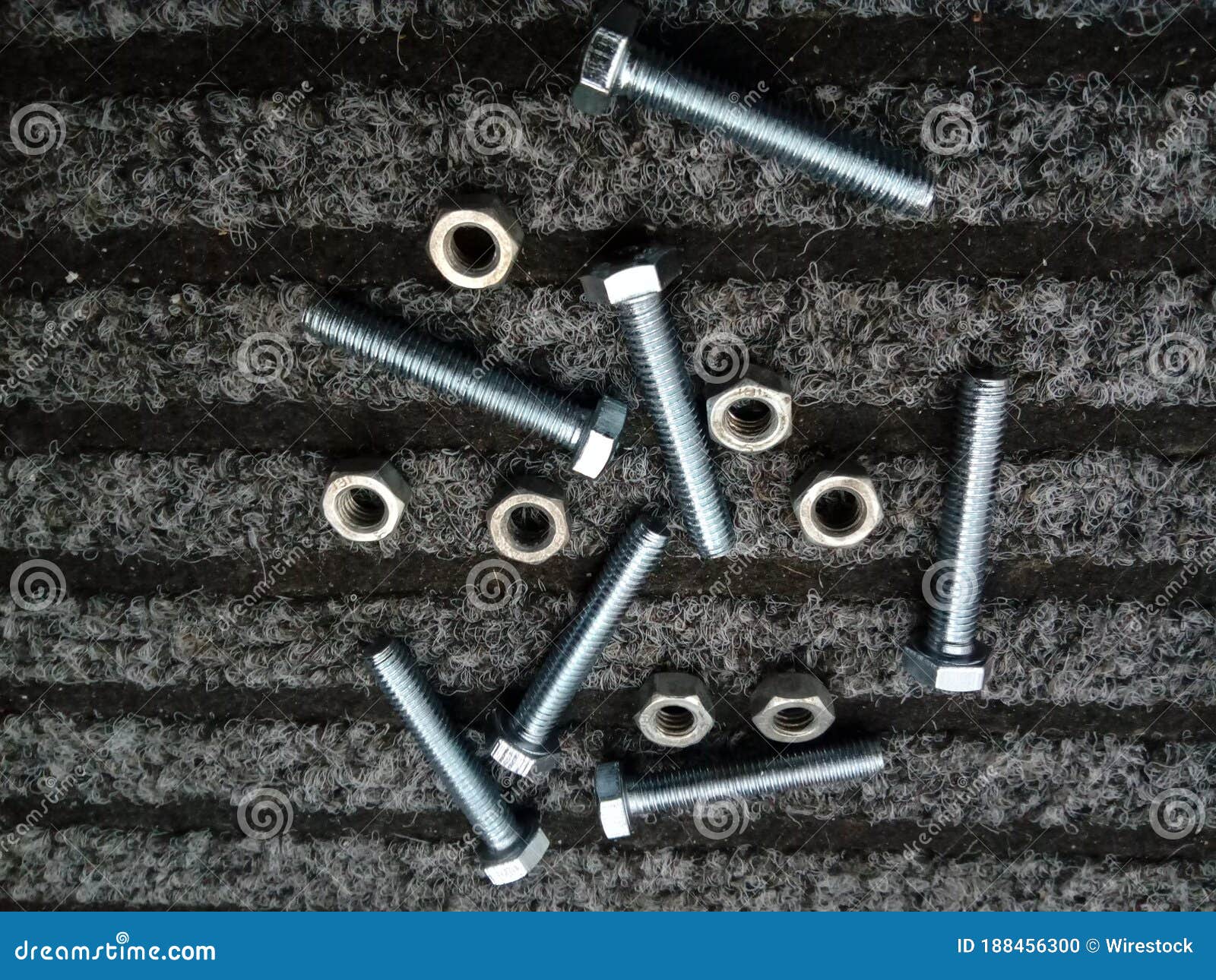 Top View of Nuts and Bolts on a Gray Surface Stock Photo - Image of ...