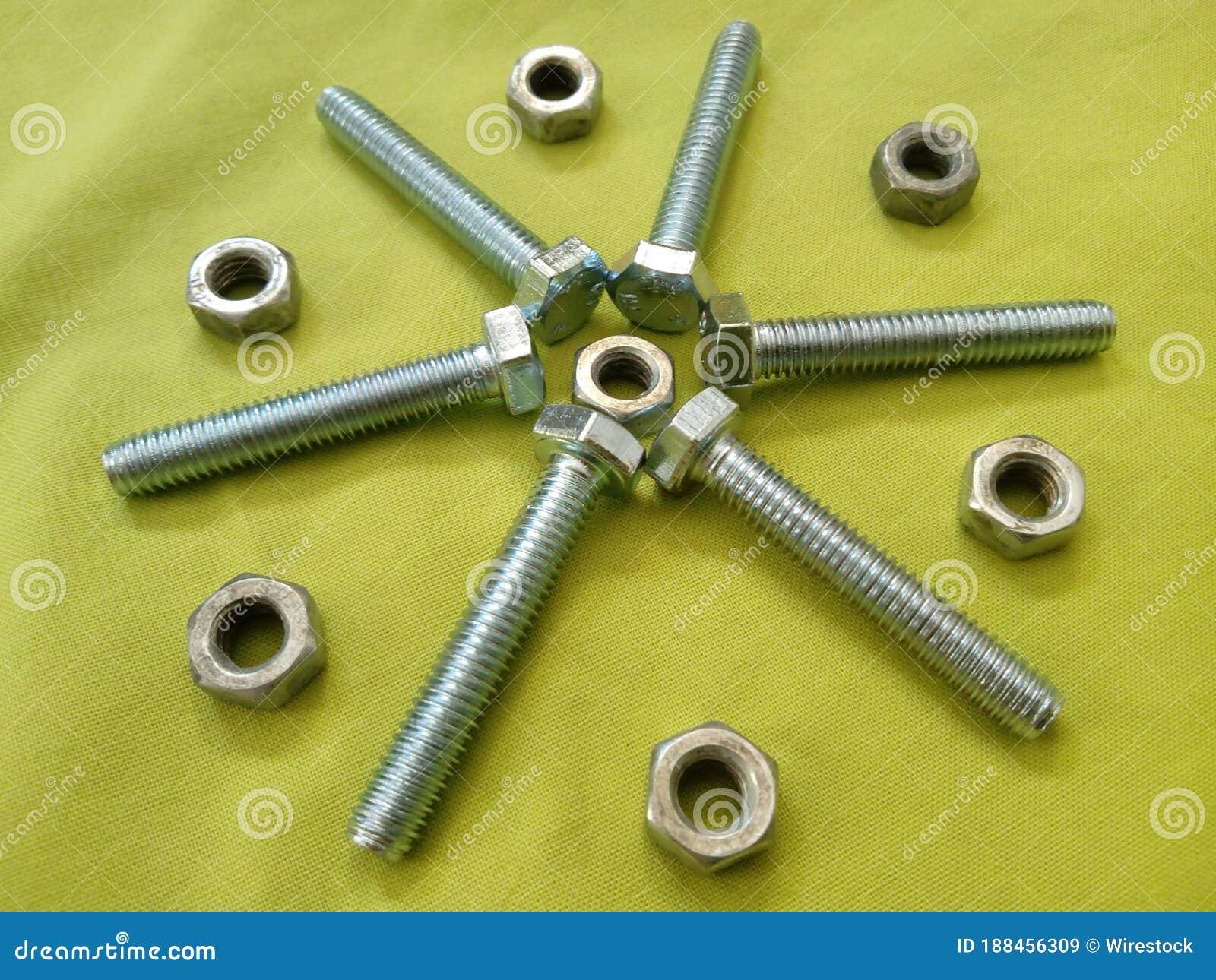 Top View of Nuts and Bolts on a Yellow Surface Stock Image - Image of ...