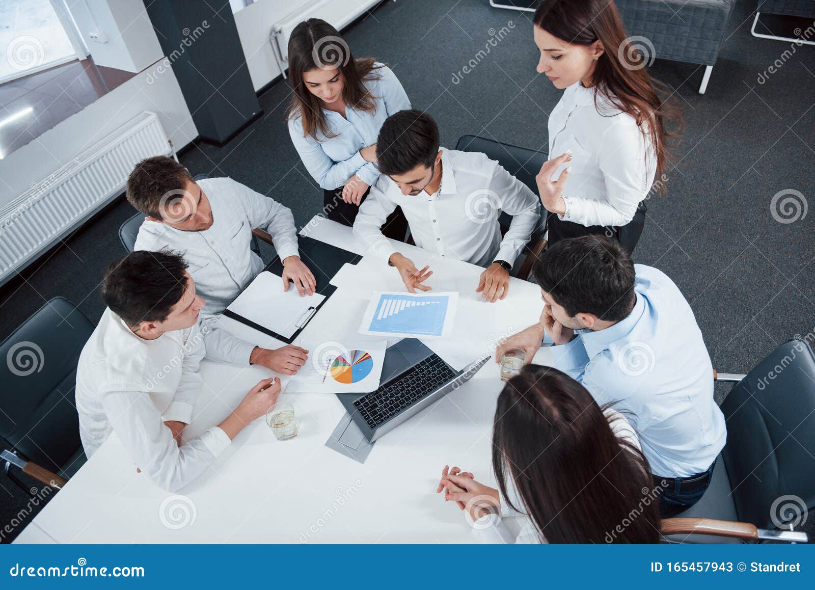 Top View of Office Workers in Classic Wear Sitting Near the Table Using ...
