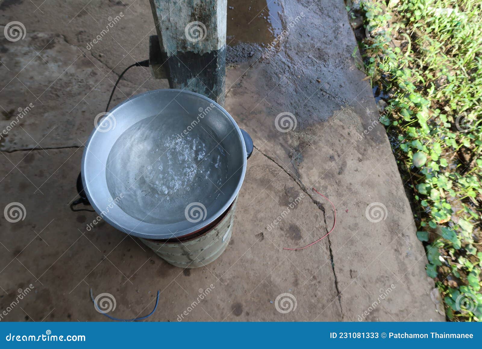 Boiling Hot Asphalt Is Filled Into A Bucket From An Asphalt Machine To ...