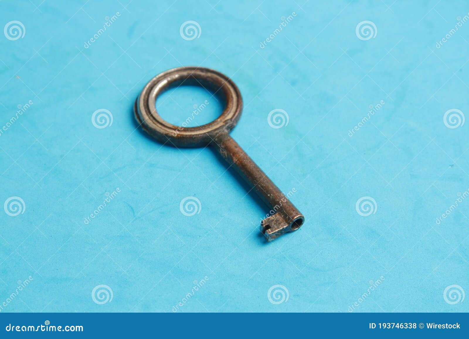 Top View of an Old Rusty Key Isolated on a Blue Background Stock Photo ...