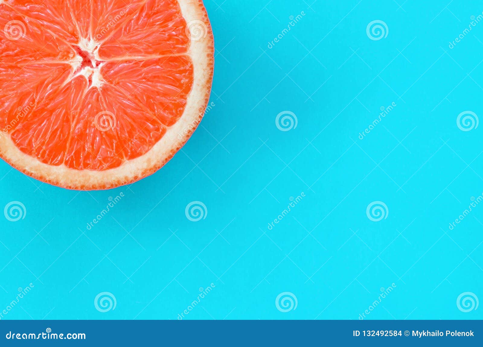 Top View of an One Grapefruit Slice on Bright Background in Blue Color ...