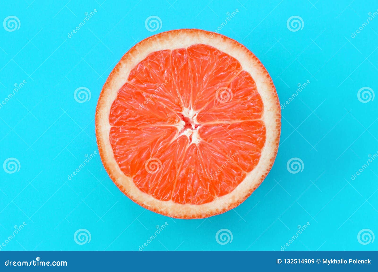 Top View of an One Grapefruit Slice on Bright Background in Blue Color ...