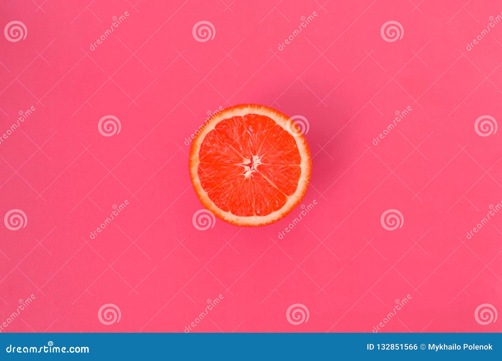 Top View of a One Grapefruit Slice on Bright Background in Light Pink ...