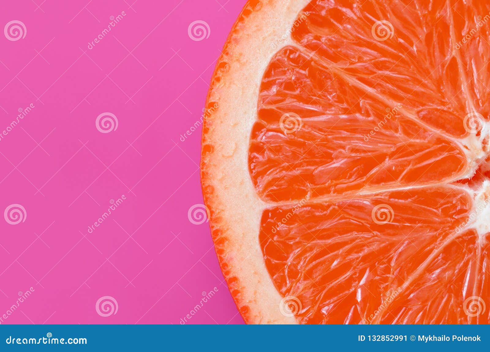 Top View of an One Grapefruit Slice on Bright Background in Purple ...