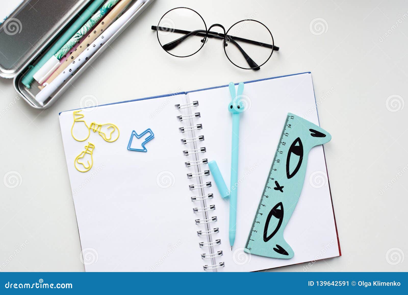 Top View of an Open Blank Notebook with a Blue Hare-shaped Pen, a Ruler ...