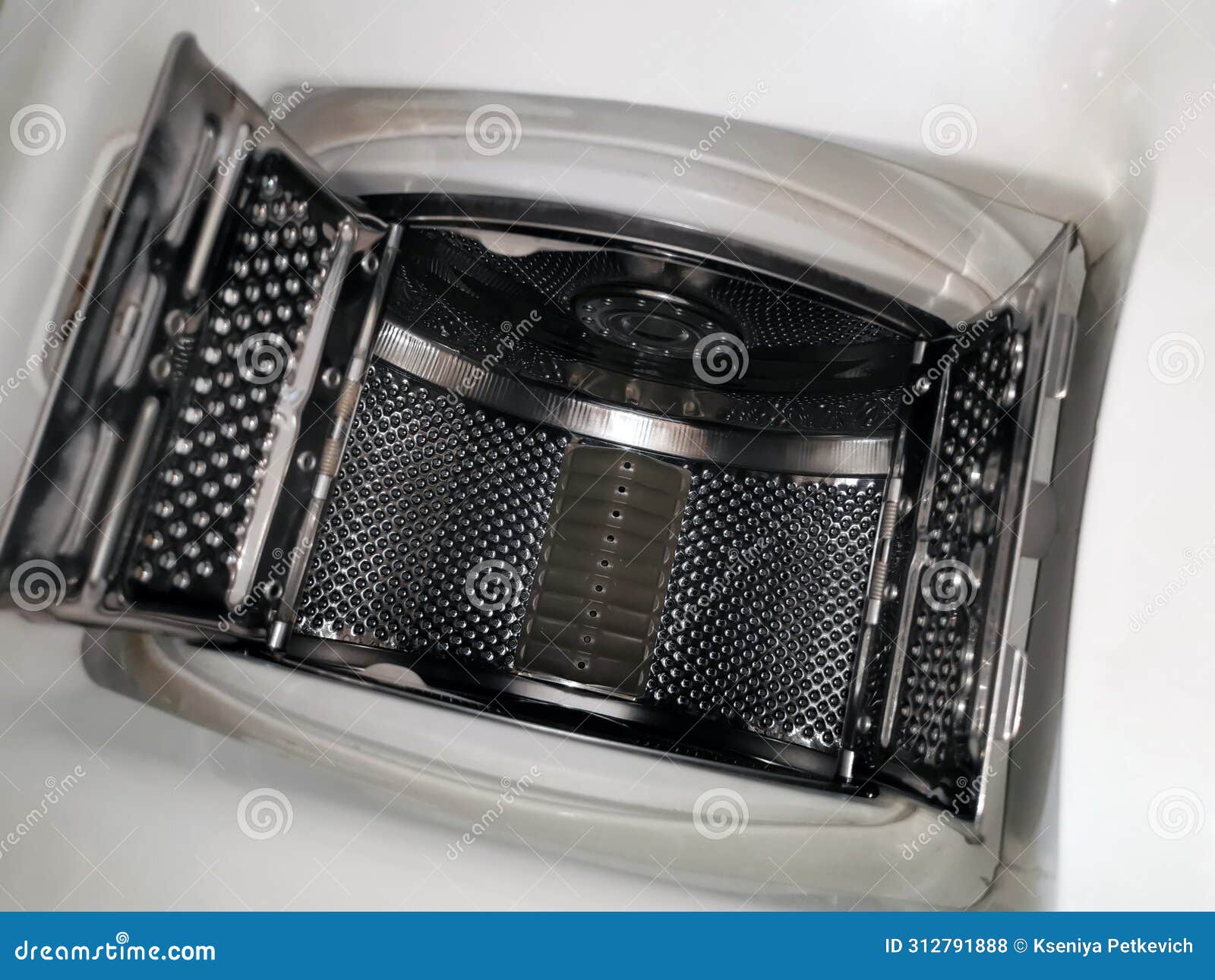 Top View of the Open Metal Drum of a White Washing Machine with ...