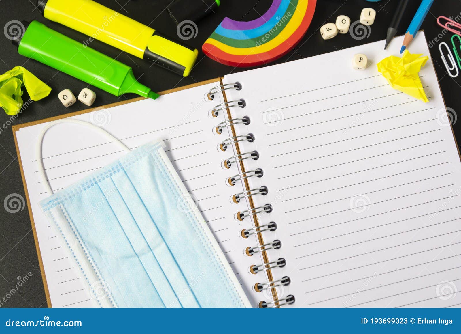 Top View of Open Notebook with Face Mask, Colorful Pencils, Rainbow ...