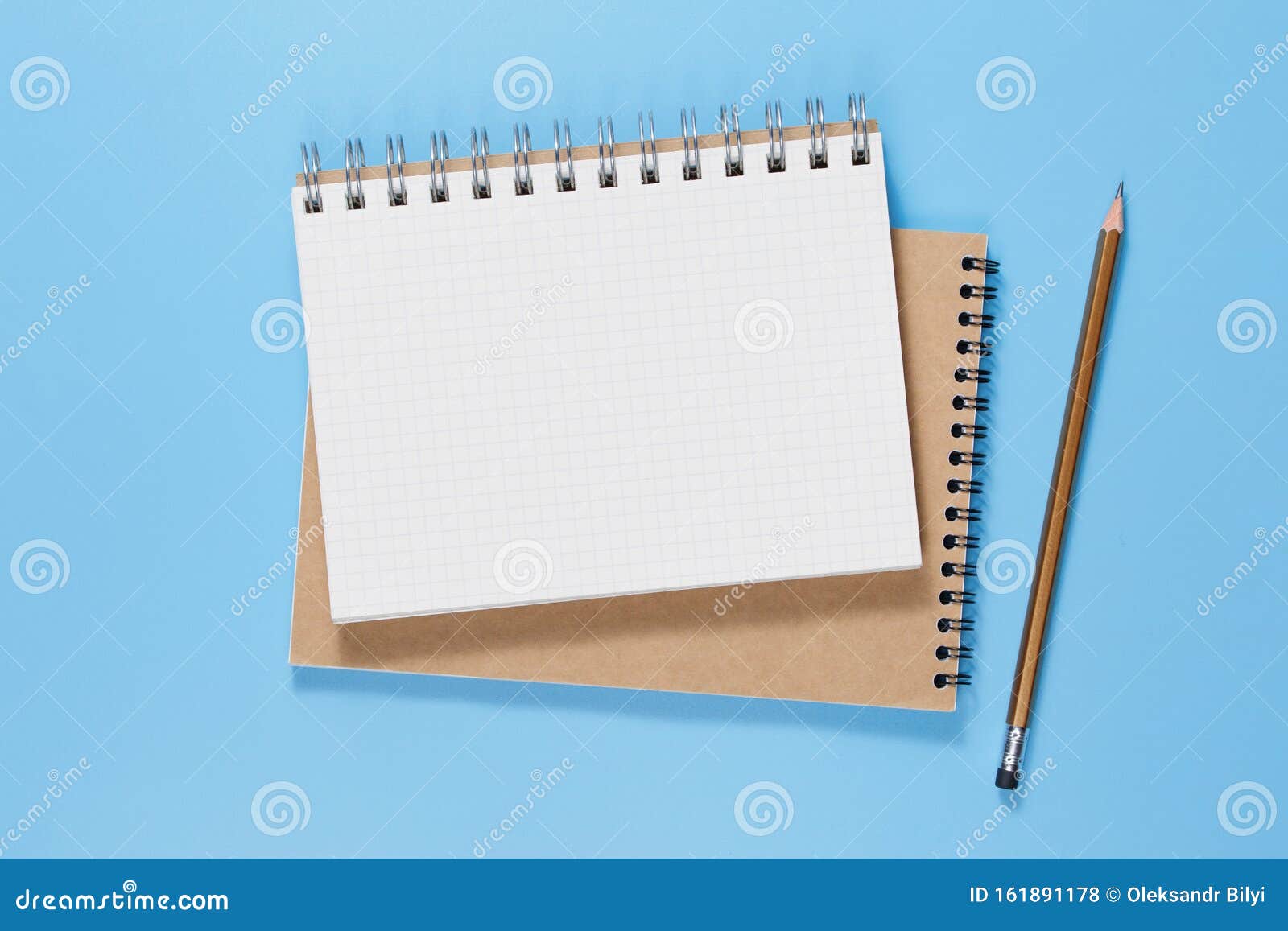 Top View of Open Notebook with Pencil on Blue Background Stock Photo ...