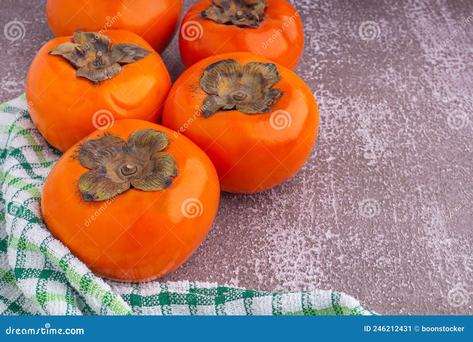 Top View of Persimmons with Cloth on a Gray Stone Background with Copy ...