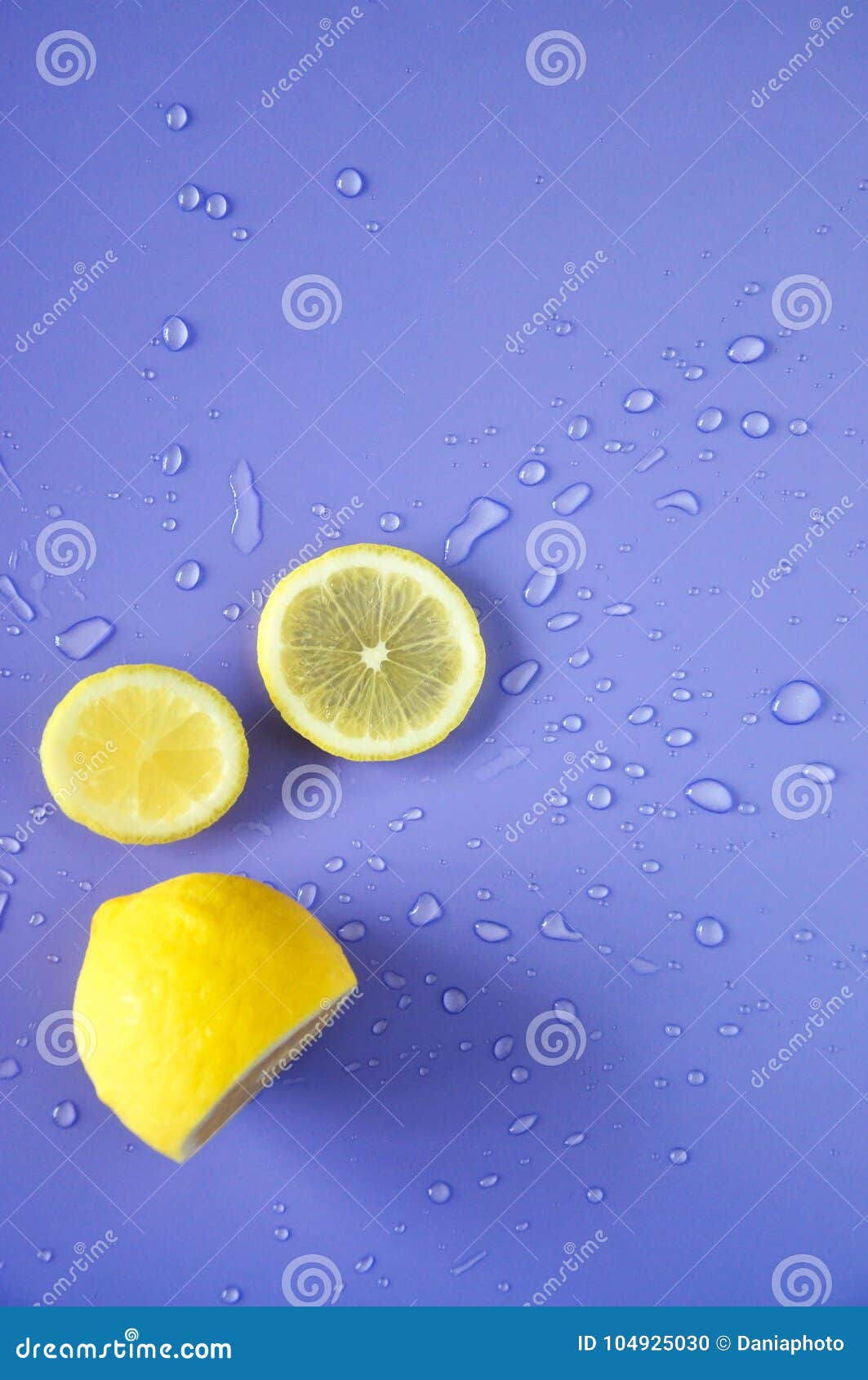 Top View of Pieces of Lemon with Water Drop on Background Stock Photo ...