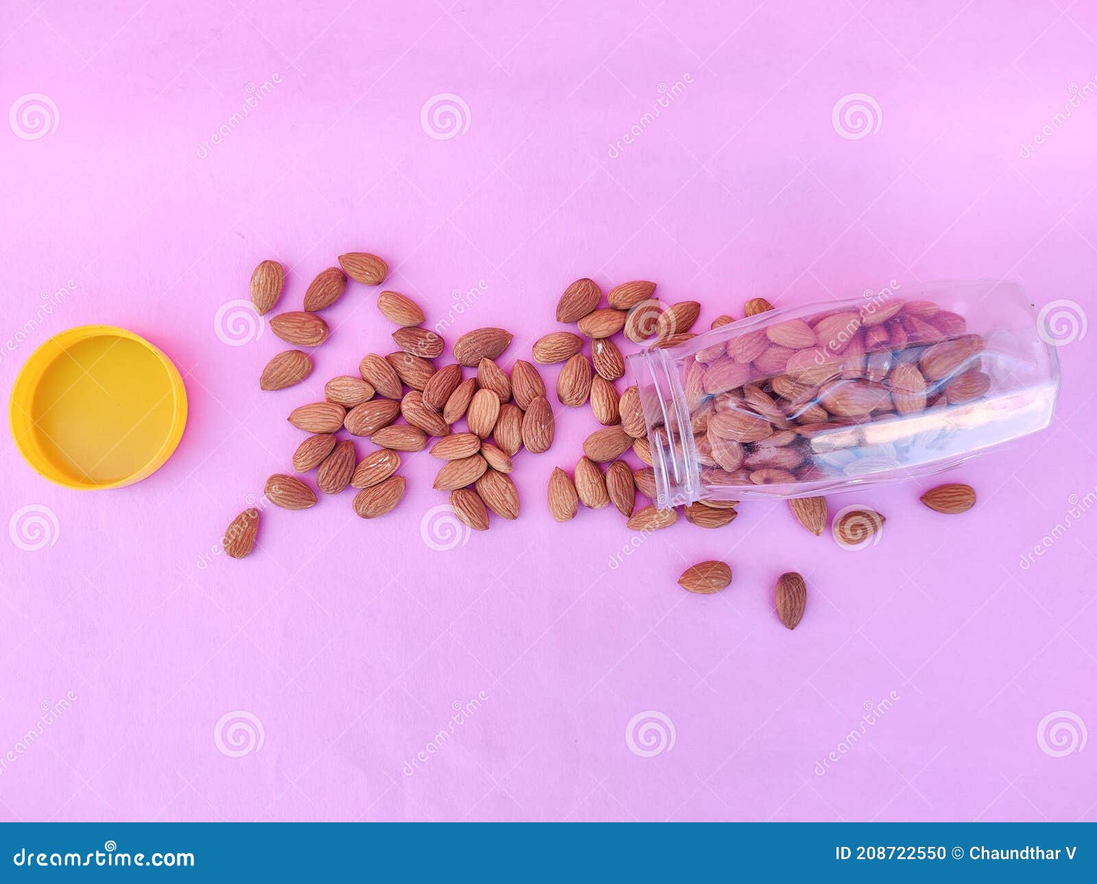 Top View of Pile of Almonds Pour from Plastic Container. Stock Photo ...