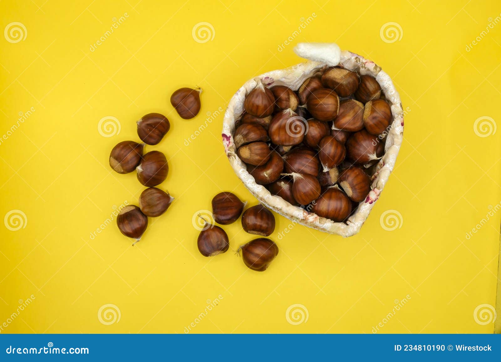 Top View of a Pile of Hazelnuts in a Heart Shaped Container on the ...