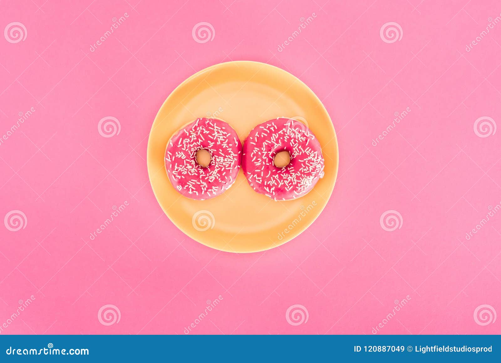 Top View of Pink Glazed Doughnuts on Yellow Plate Stock Image - Image ...