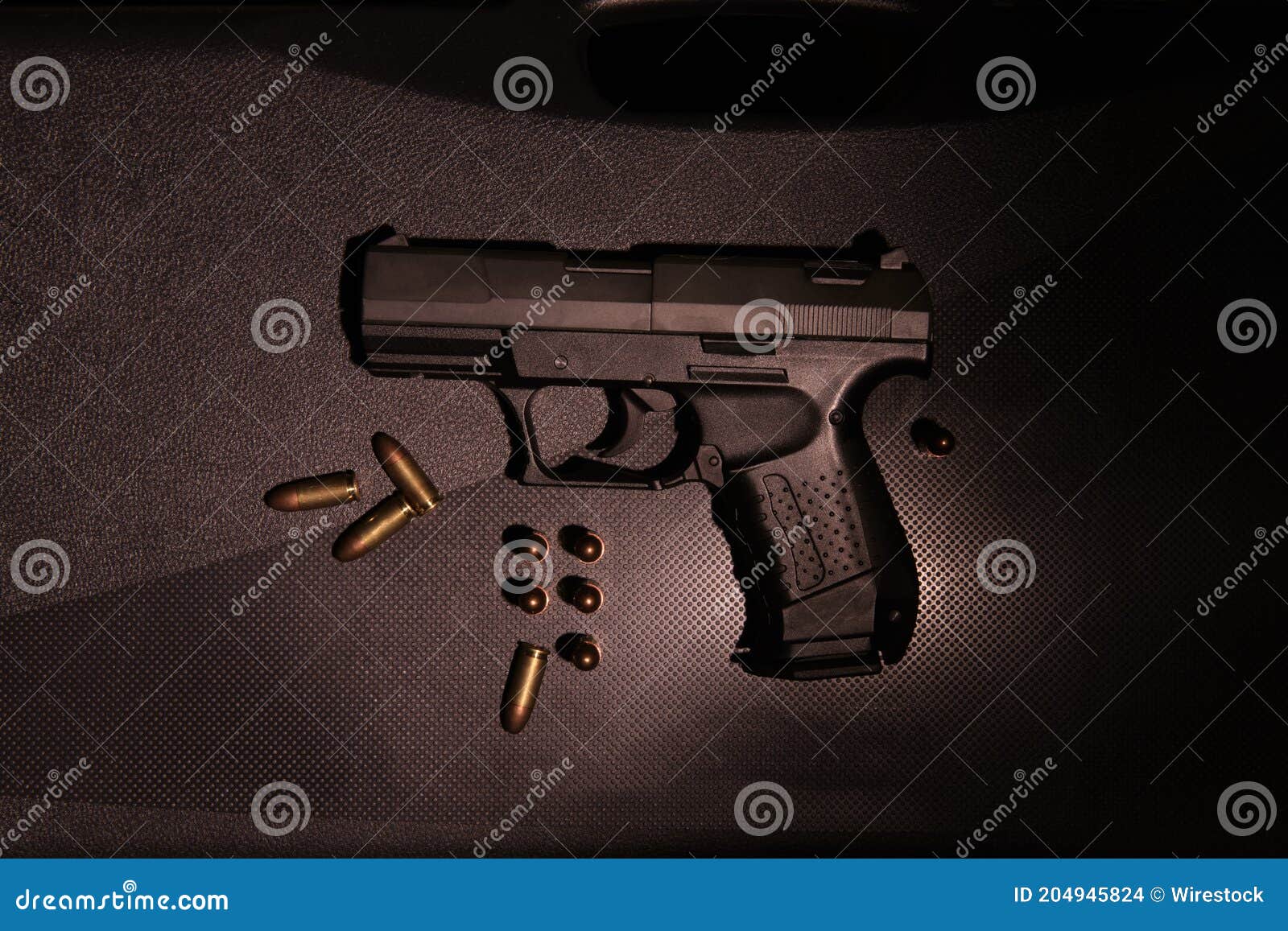 Top View of a Pistol with Bullets on a Dark Surface Stock Photo - Image ...