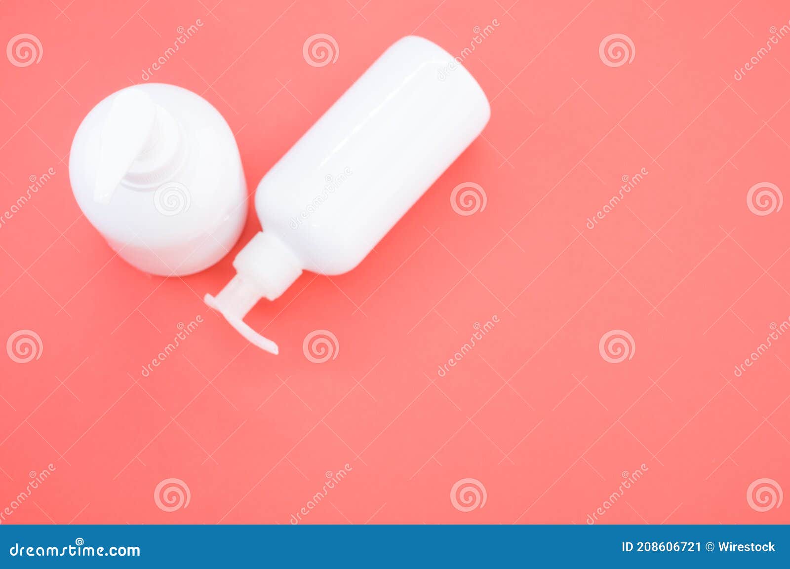 Top View of Plastic Bottles with Pumps on a Red Surface Under the Light ...