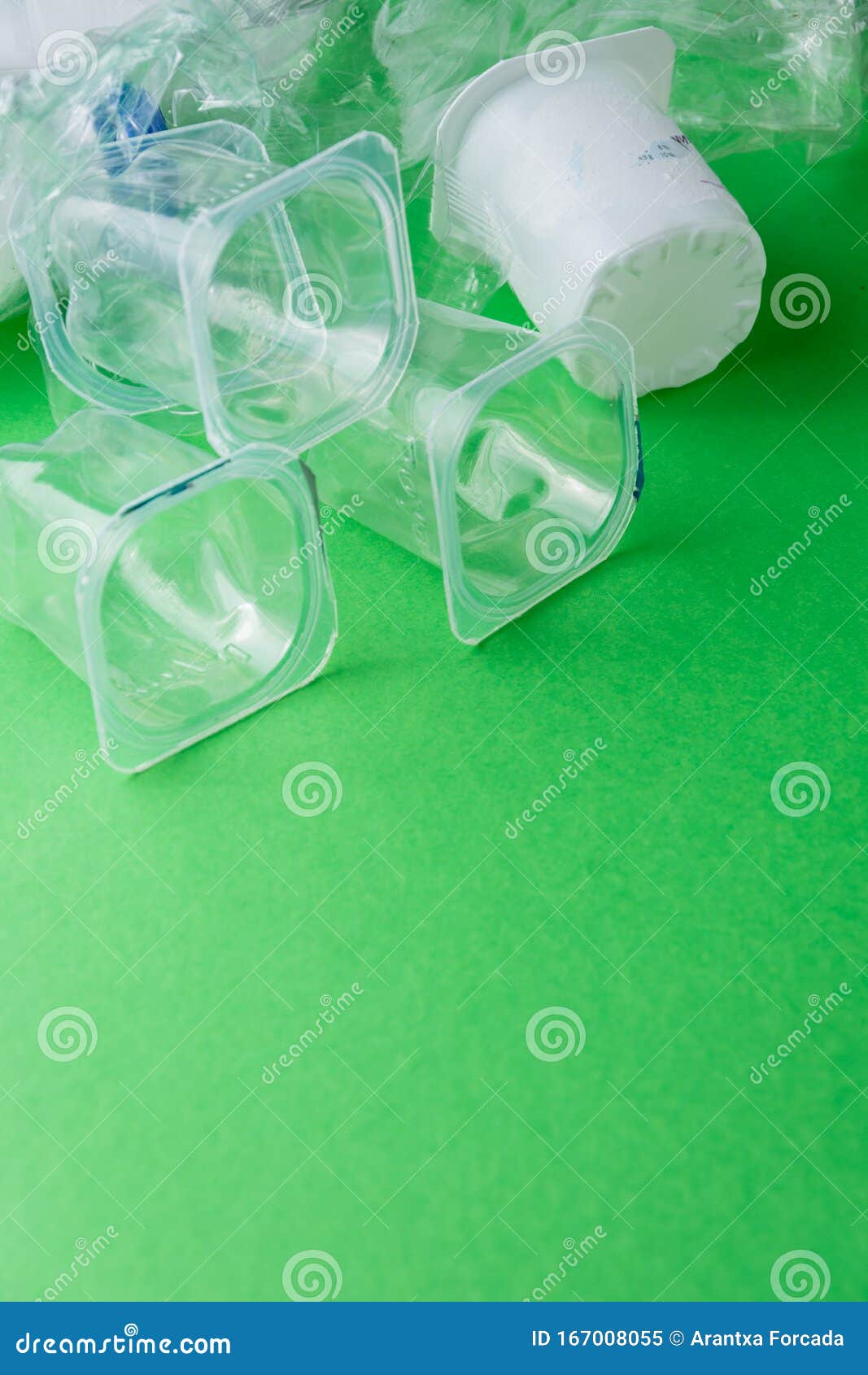 Top View of Plastic Containers on Green Background, Ready for Recycling ...
