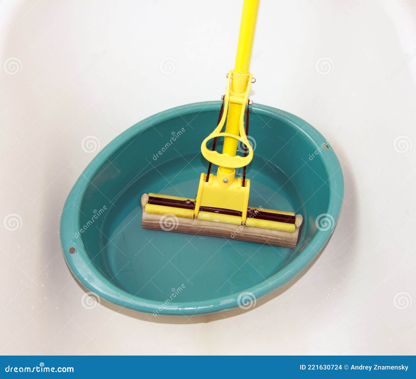 Top View of a Plastic Green Basin with Water and a Mop with a Sponge on ...