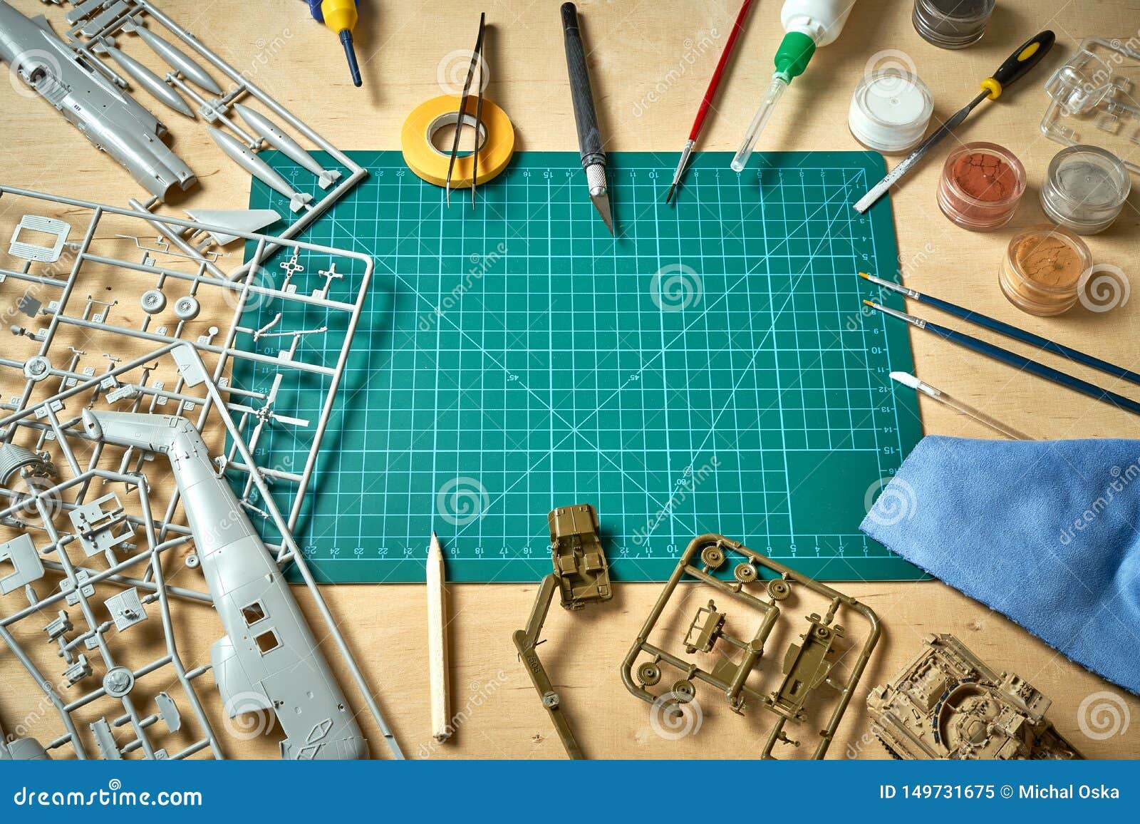 Top View on Plastic Model Scale with Accessories on Green Pad on Wooden ...