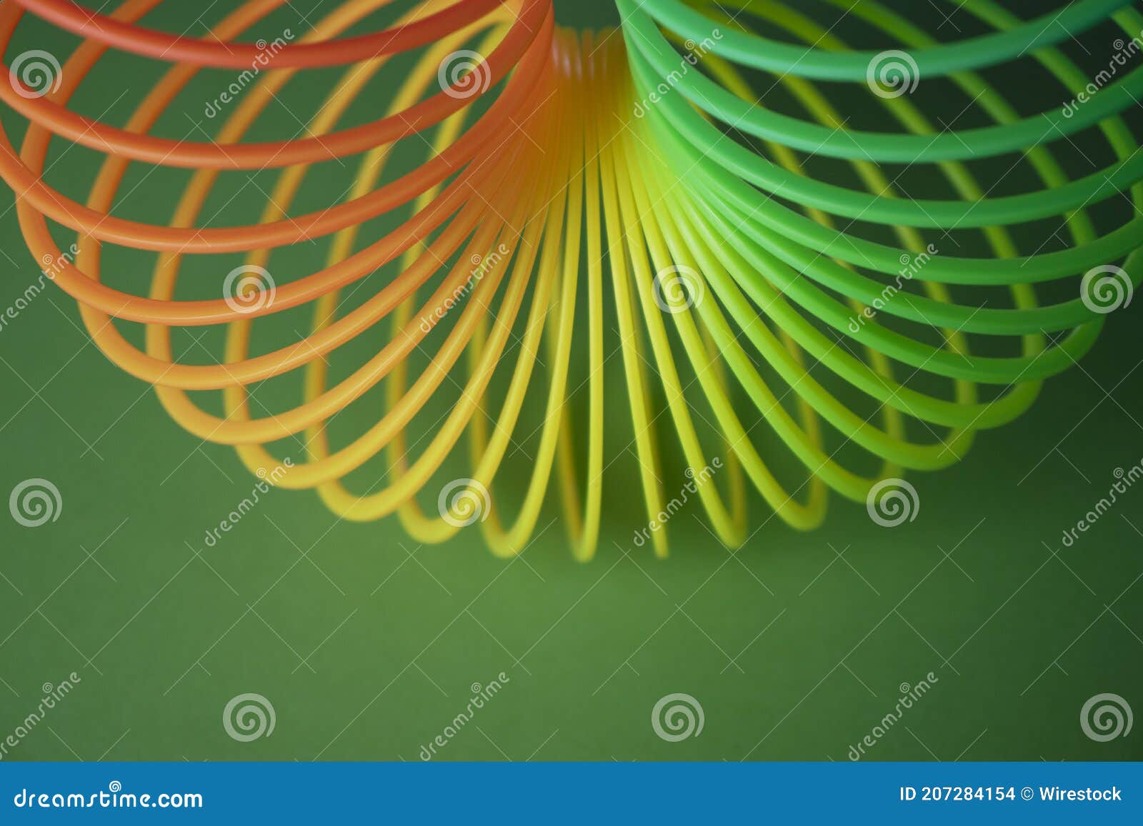 Top View of Plastic Rainbow Magic Spring Toy Isolated on Green ...