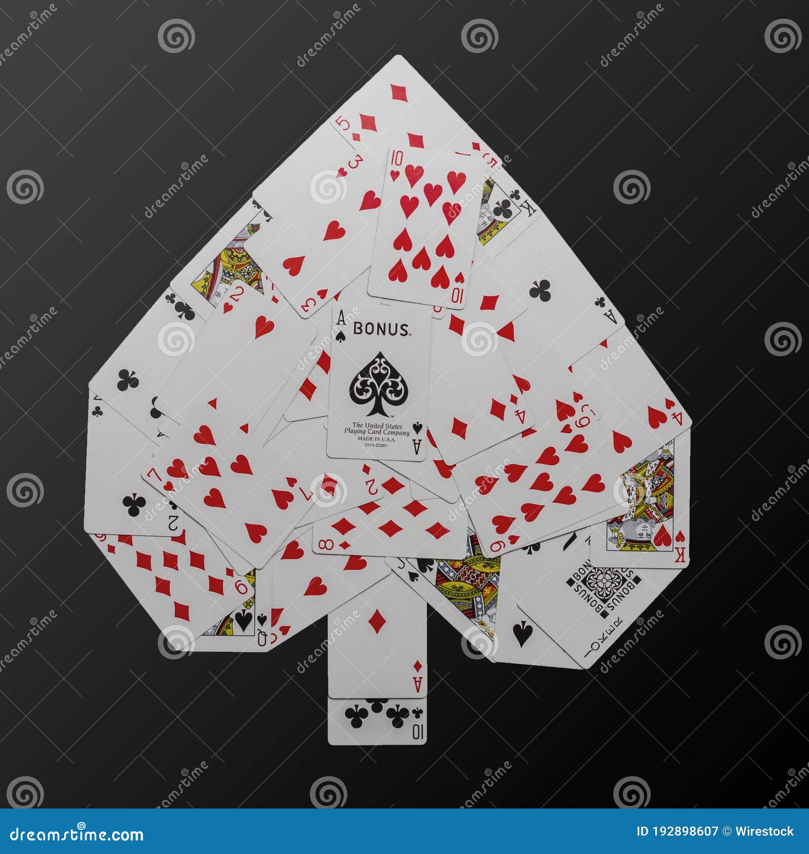 Top View of Playing Cards Forming a Spade Symbol on a Dark Blurry ...