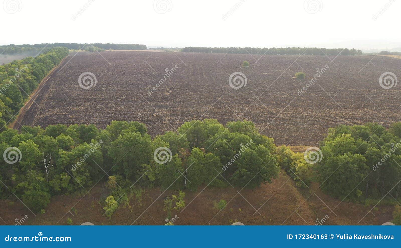 Aerial Shot of a Plowed Large Patch of Rectangular Field on a Warm ...