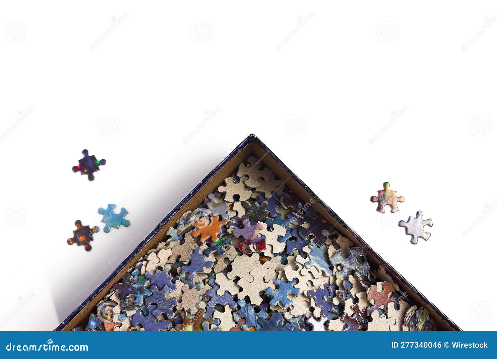 Top View of Puzzle Pieces in a Box on a White Surface with Space for ...