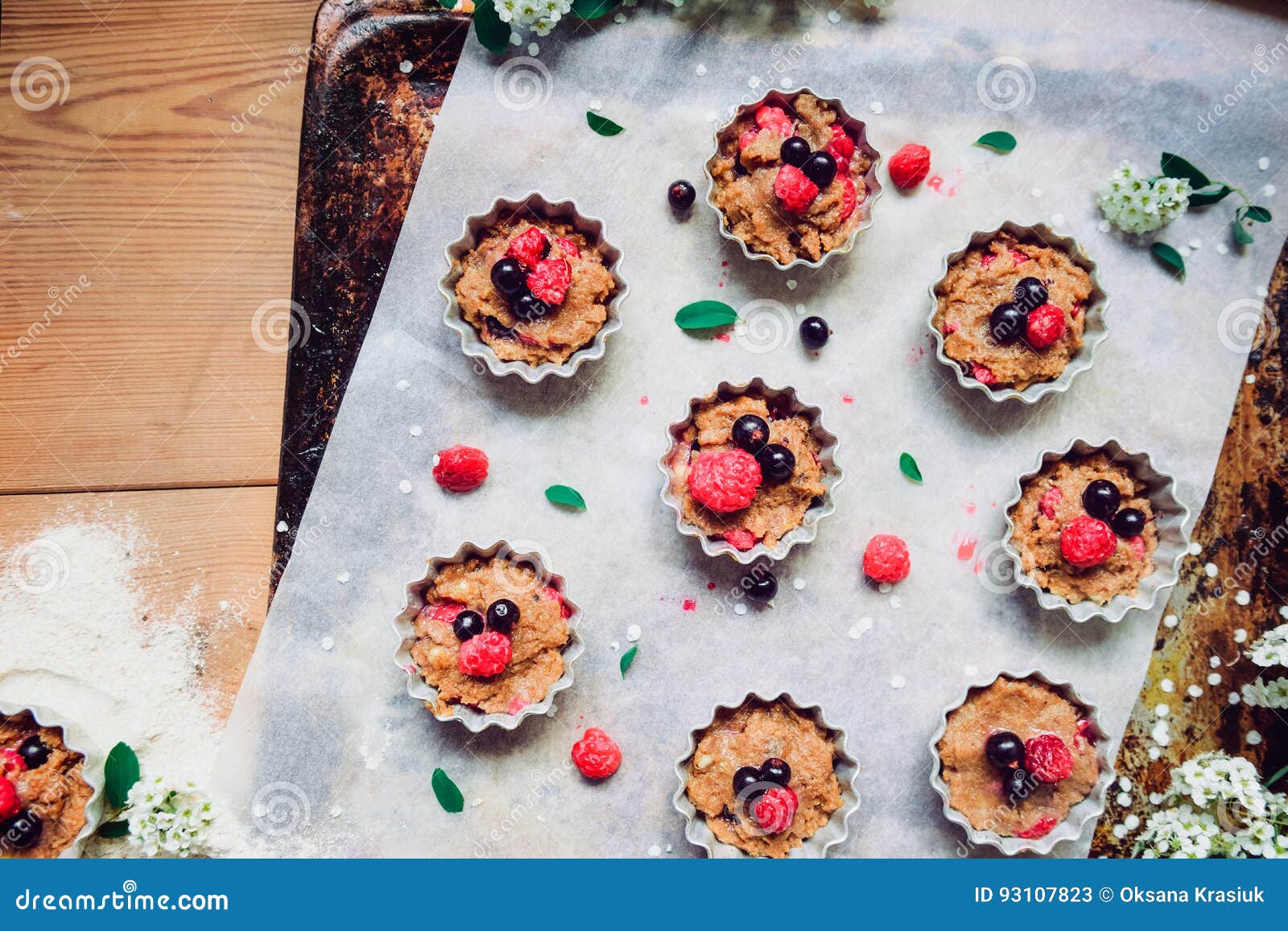 Top View Raw Dough with Berries for Cupcakes Decomposed into Forms on a ...