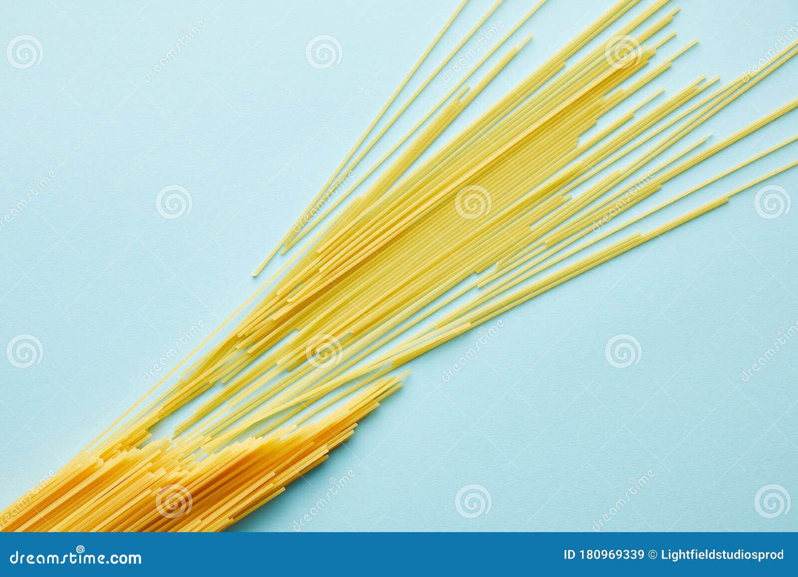 View of Raw Spaghetti on Blue Stock Image - Image of background ...