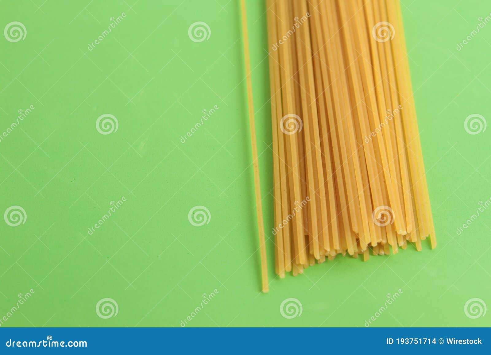 Top View of Raw Spaghetti on Green Background Stock Photo - Image of ...