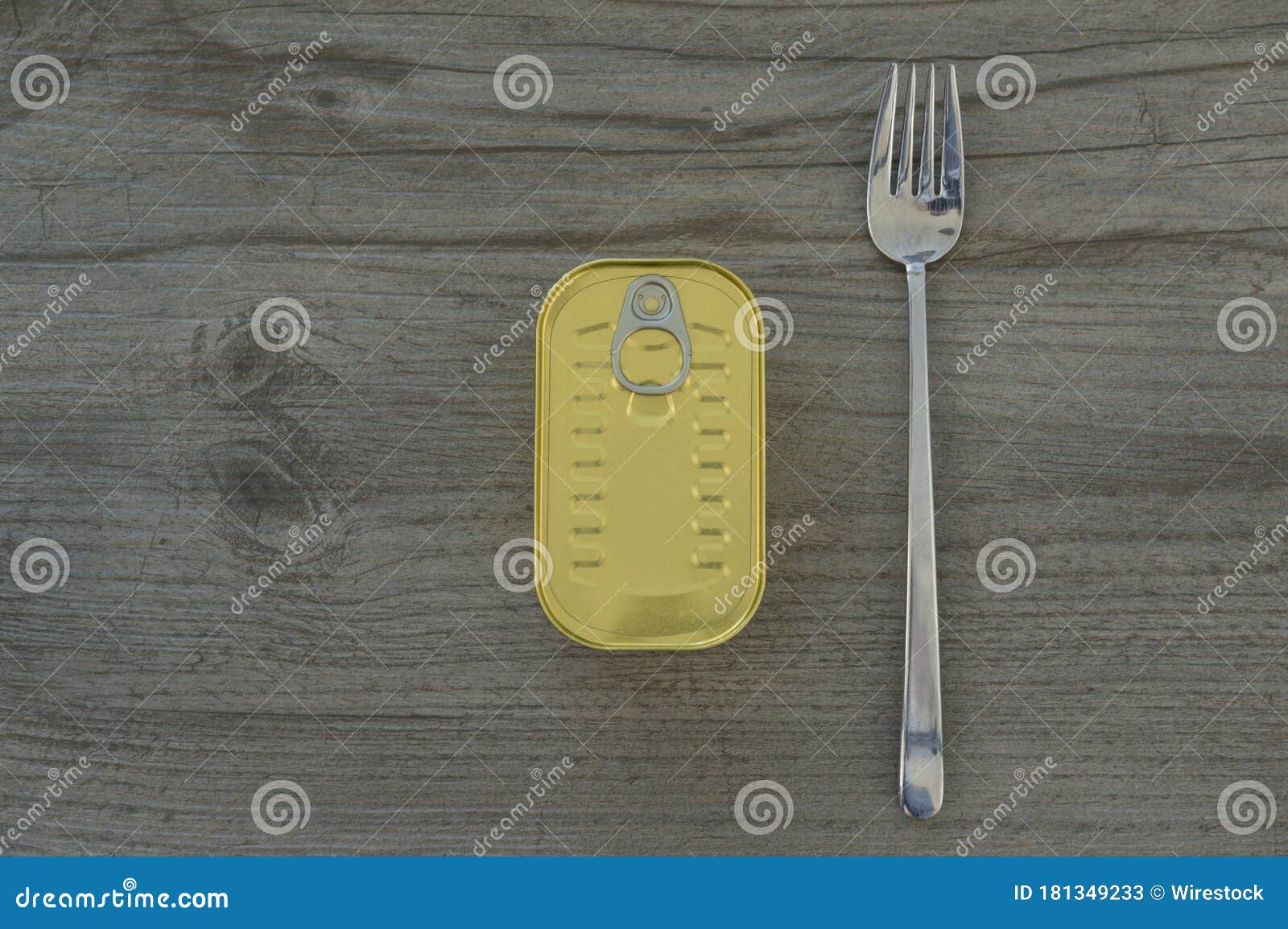 Top View of a Rectangular Tin Can and a Fork on a Wooden Table Stock ...