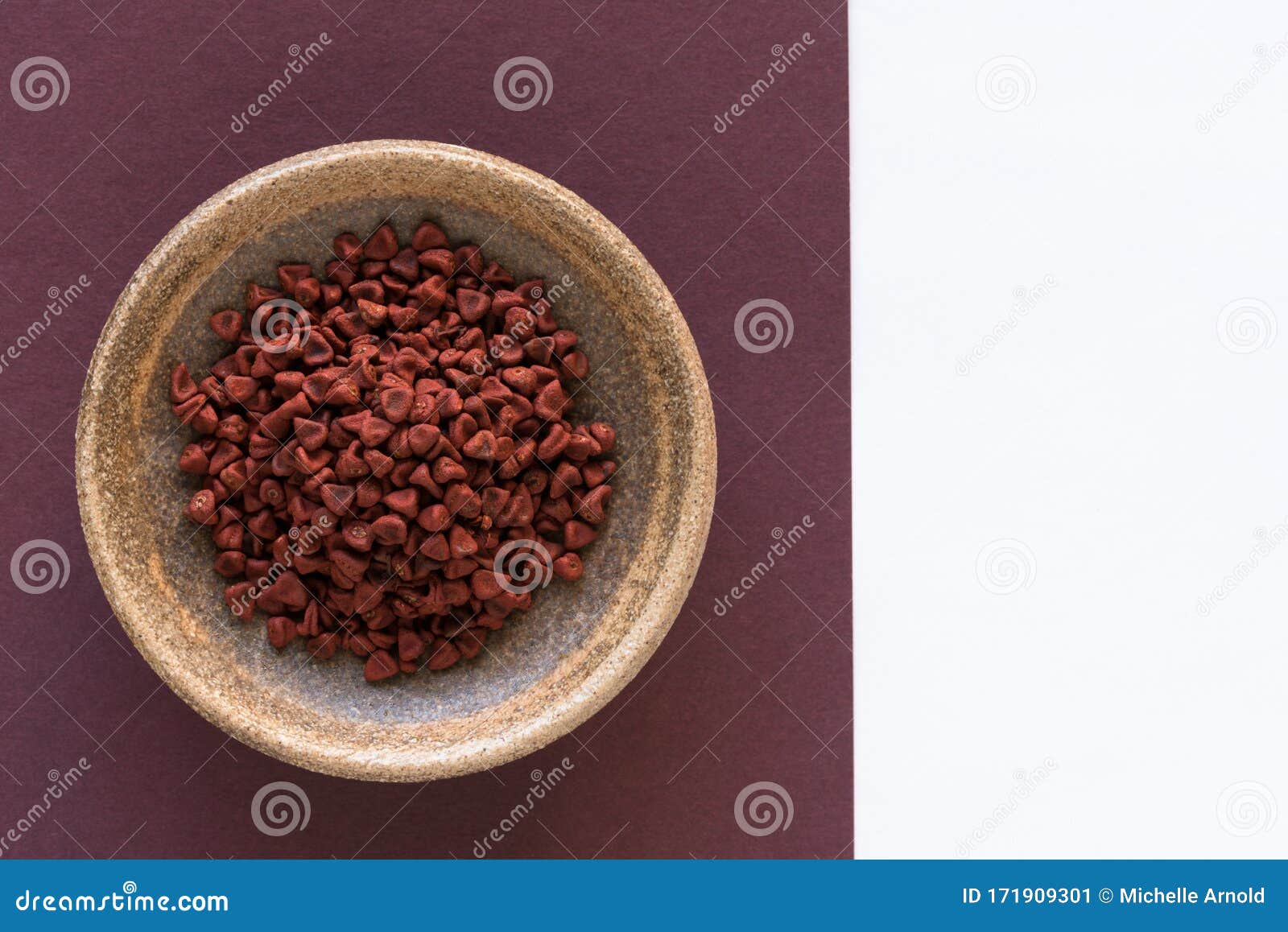 Achiote Seeds in a Bowl stock image. Image of background - 171909301