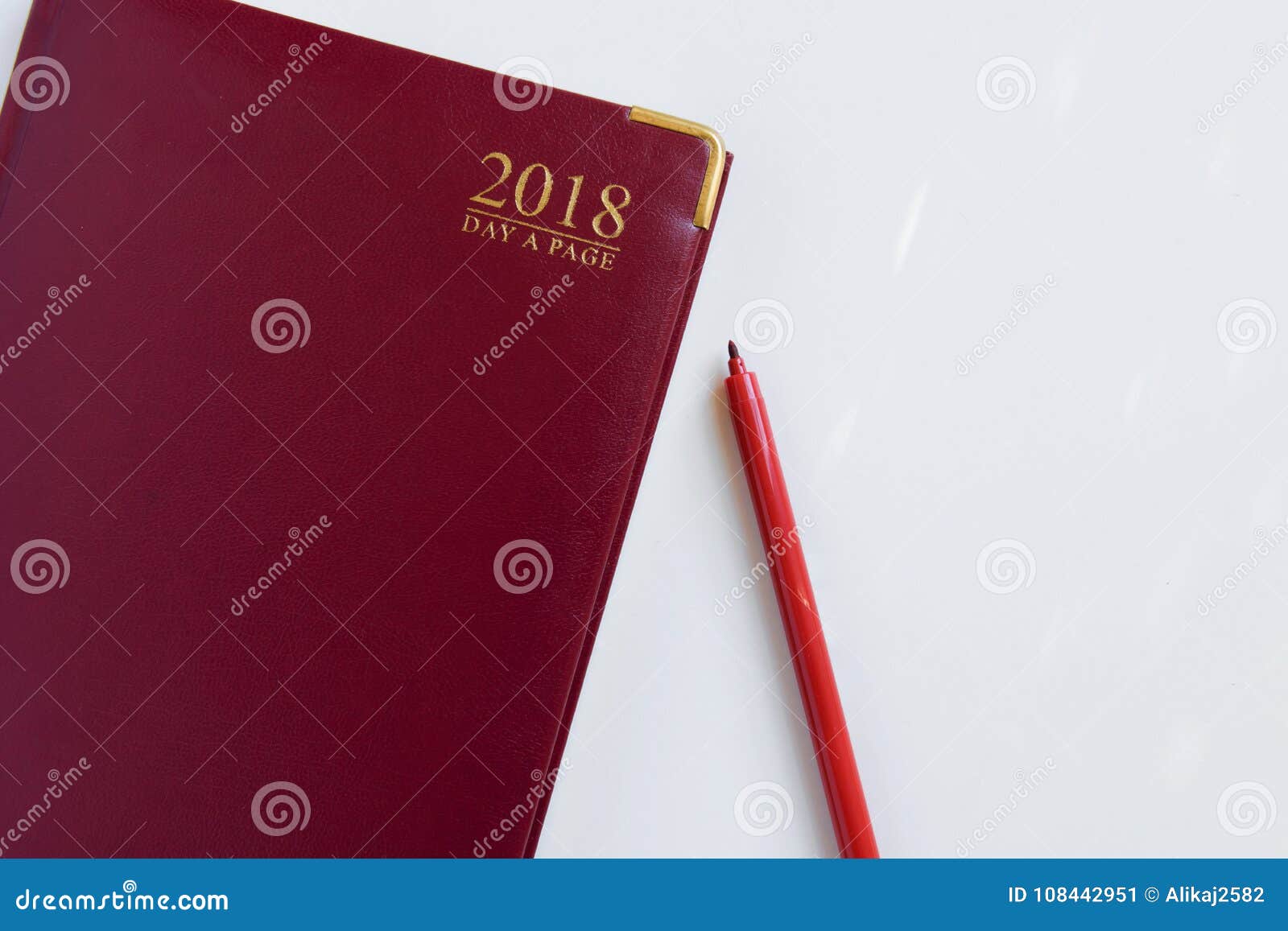 Top View of Red Diary for 2018 with Pen on White Background and Space ...