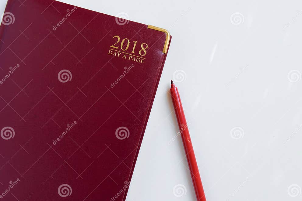 Top View of Red Diary for 2018 with Pen on White Background and Space ...