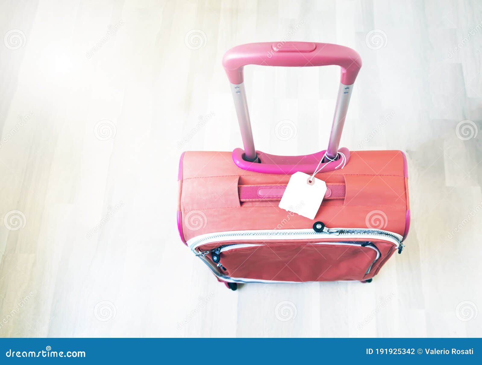 Top View of a Red Suitcase with the Handle Raised and a Blank Label ...