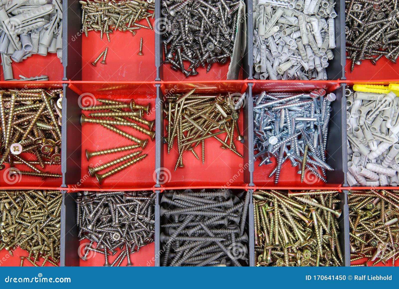 Top View on Red Tool Box with Square Compartments with Screws and ...