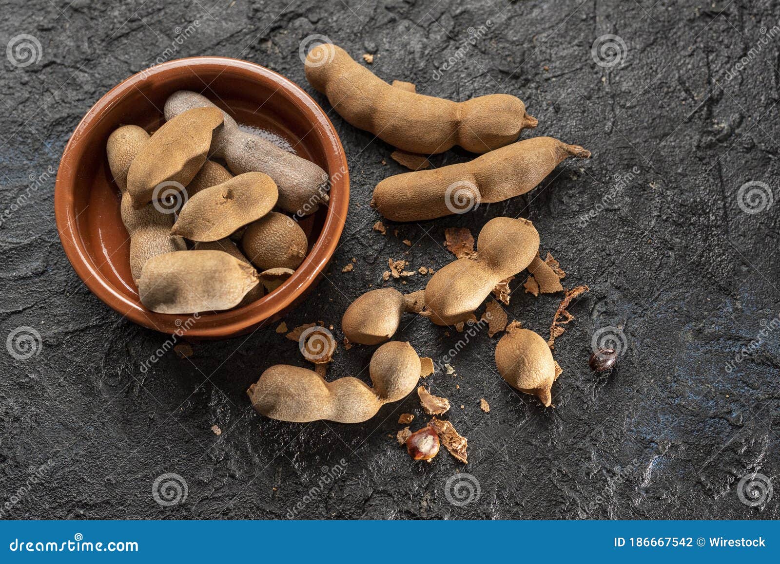 Top View of Ripe Tamarind in a Brown Cup and on the Floor Stock Photo ...