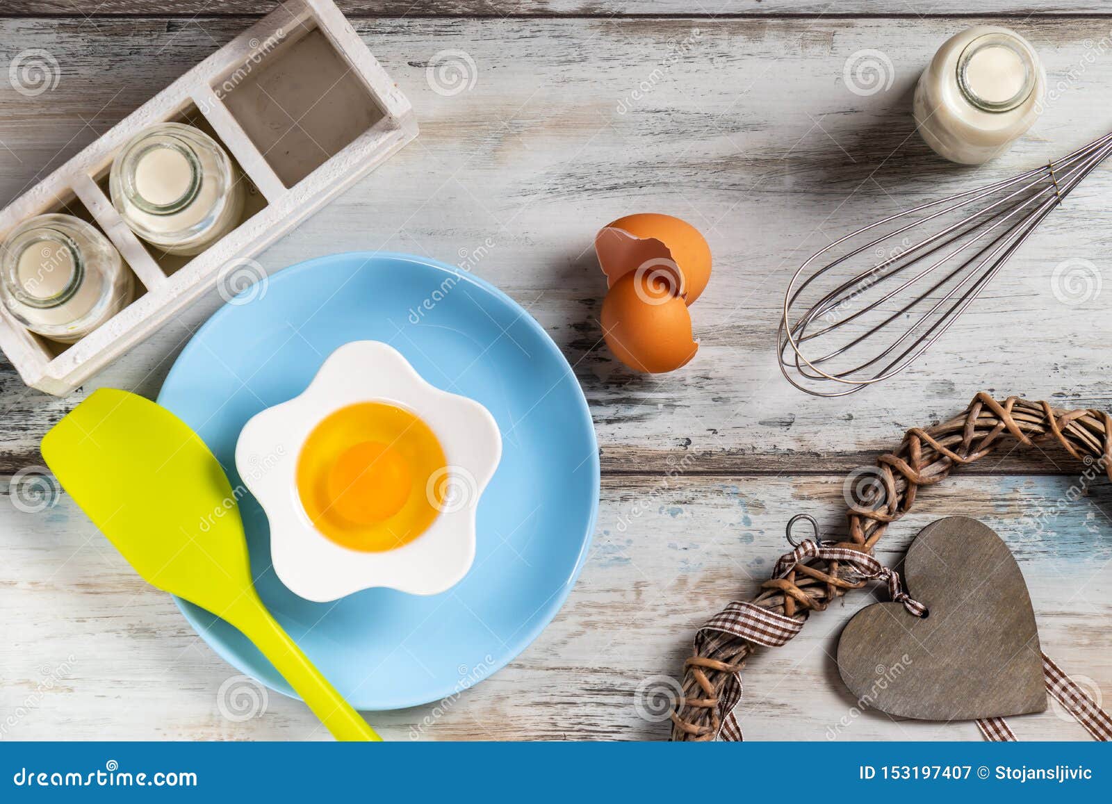 Top View of a Rustic Kitchen Table with Raw Egg in a Flower Shaped Bowl ...