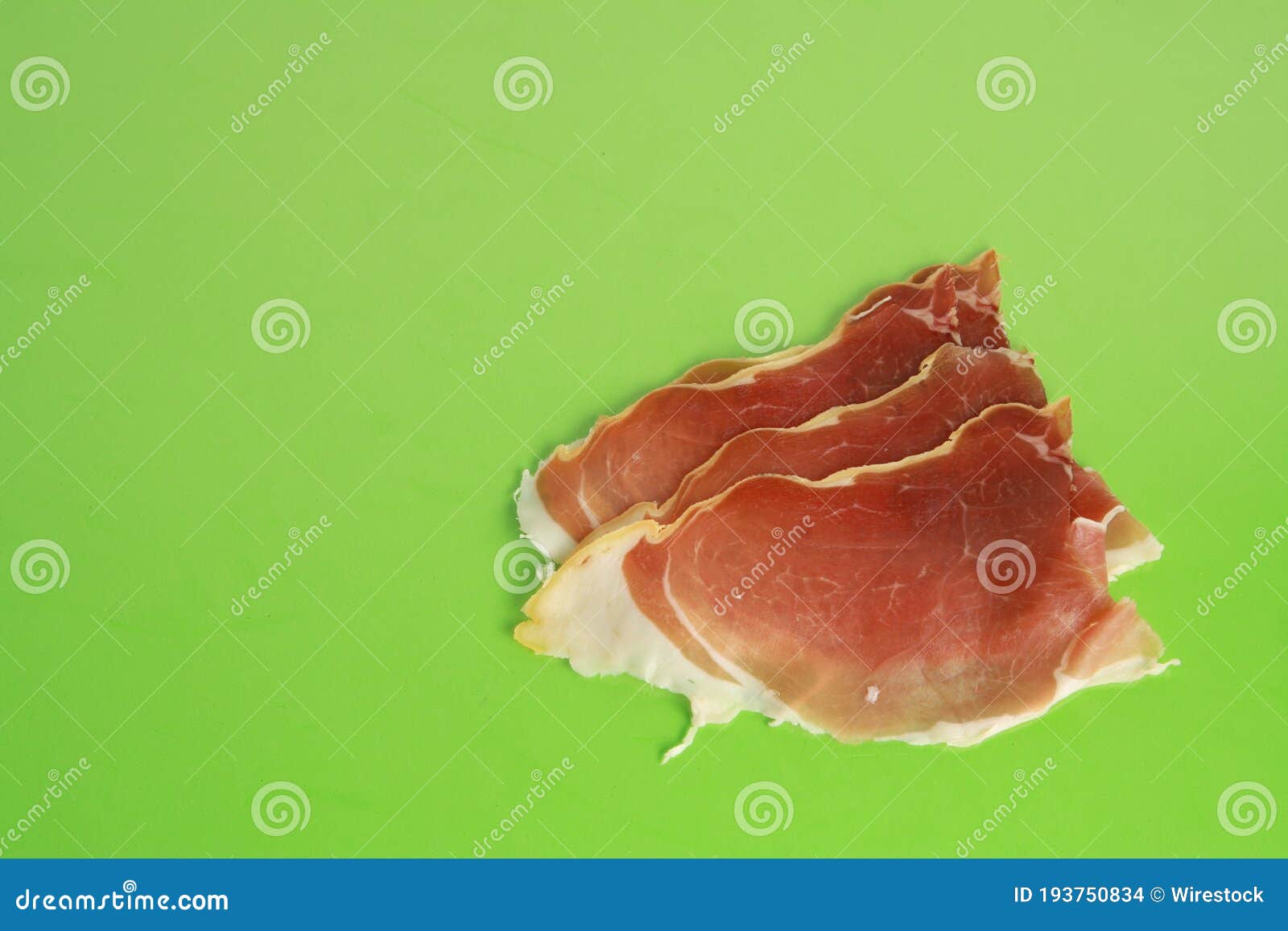 Top View of Serrano Ham Slices Isolated on a Green Background Stock ...