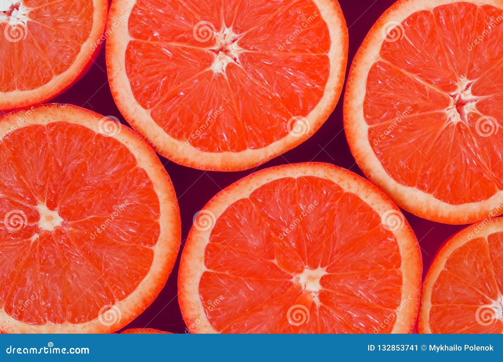 Top View of a Several Grapefruit Slices on Bright Background in Pink ...