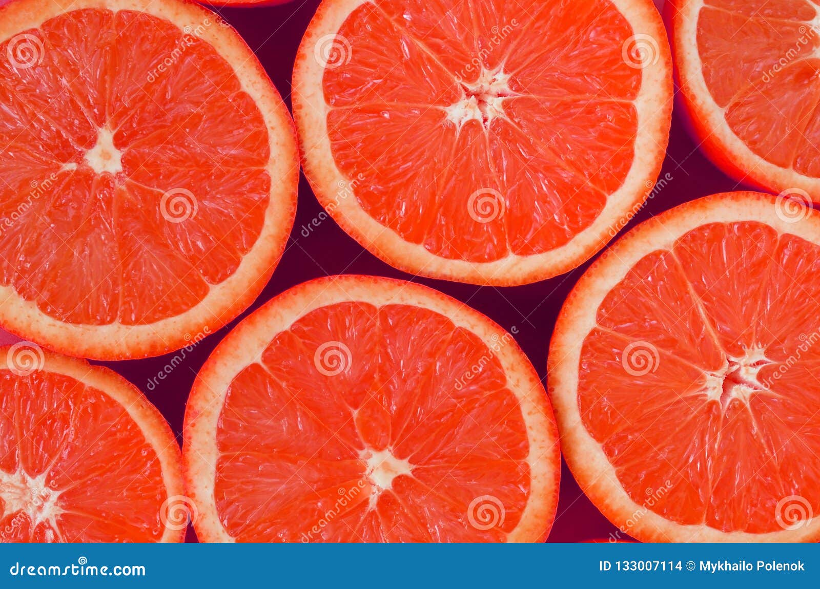 Top View of a Several Grapefruit Slices on Bright Background in Pink ...