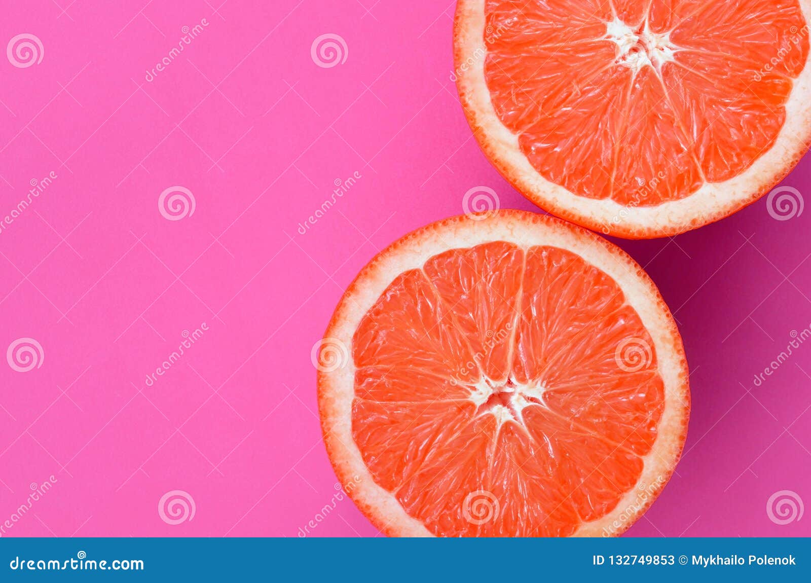 Top View of a Several Grapefruit Slices on Bright Background in Purple ...