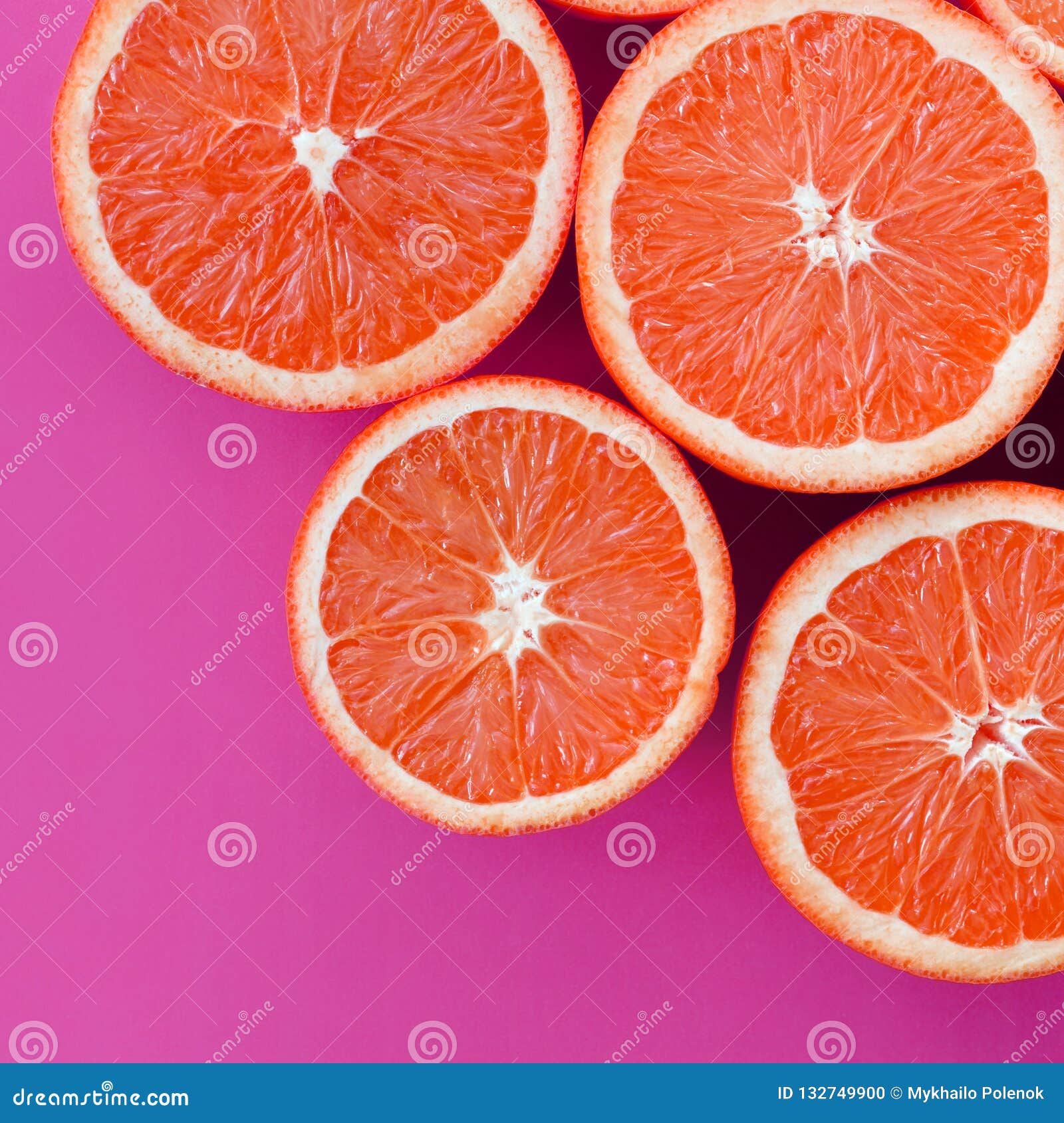 Top View of a Several Grapefruit Slices on Bright Background in Purple ...