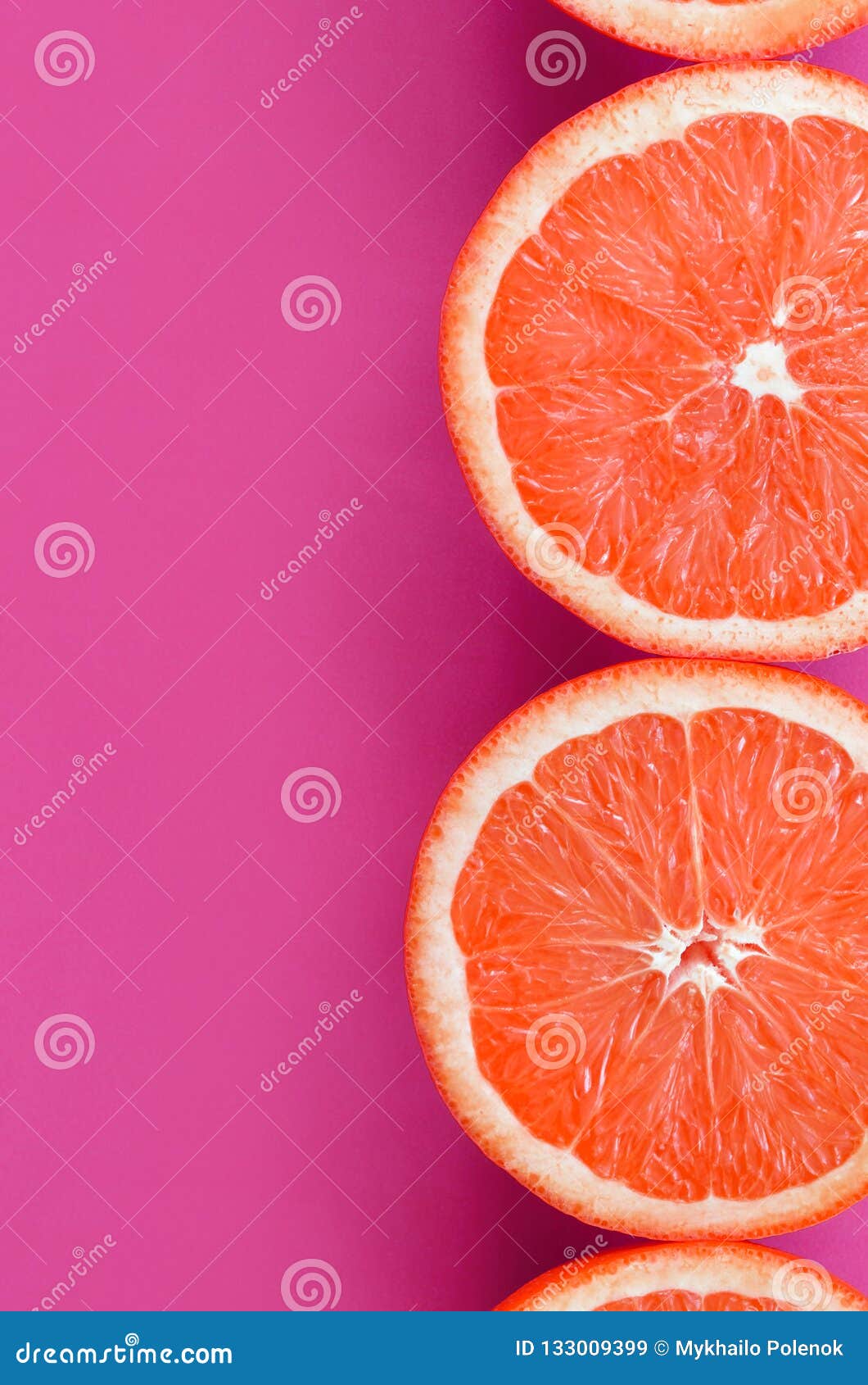 Top View of a Several Grapefruit Slices on Bright Background in Purple ...