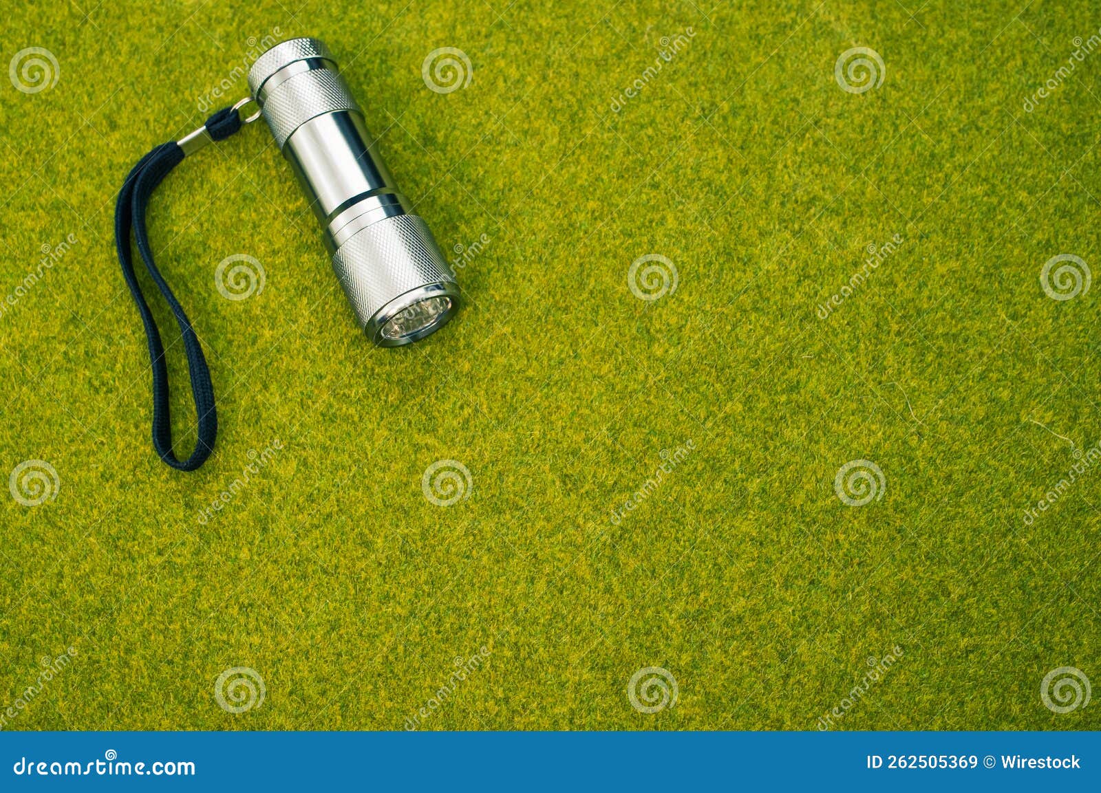 Top View Shot of a Flashlight on a Green Grass Surface Stock Image ...