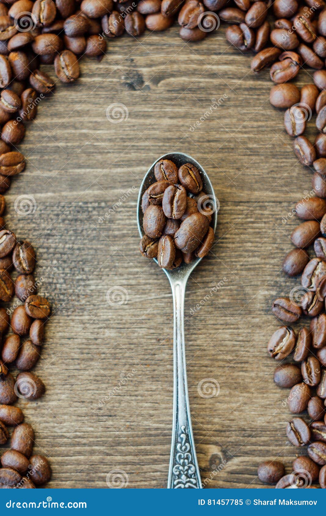 Top View of a Silver Teaspoon Filled with Roasted Coffee Beans on a ...