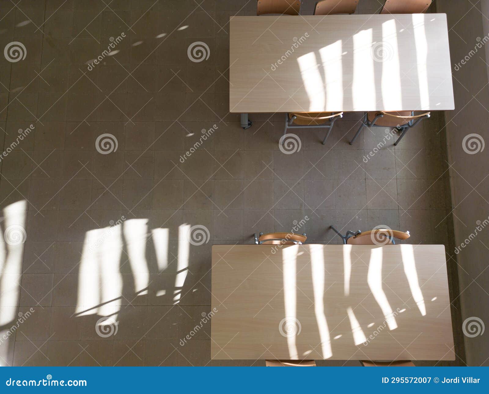 Top View of Similar Upside Down Chairs Placed on Wooden Table in Light ...