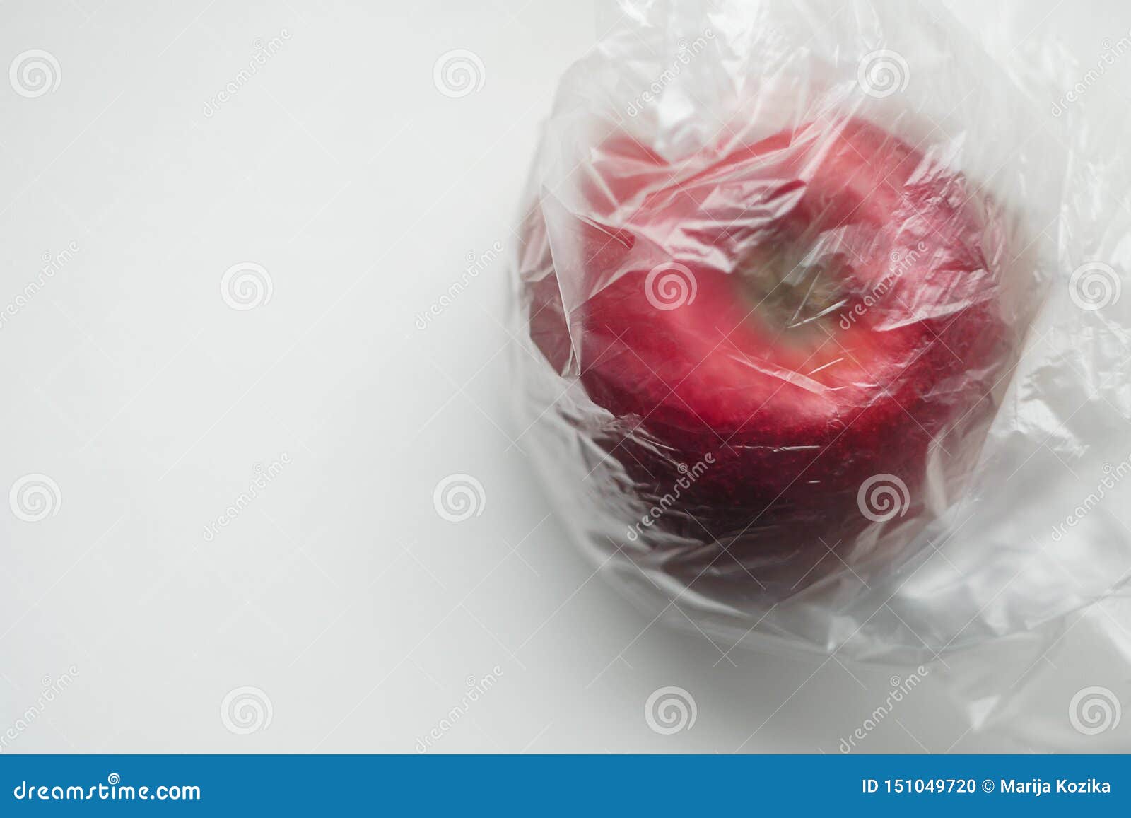 Top View of Single Red Apple Wrapped in a Transparent Plastic Bag Stock ...